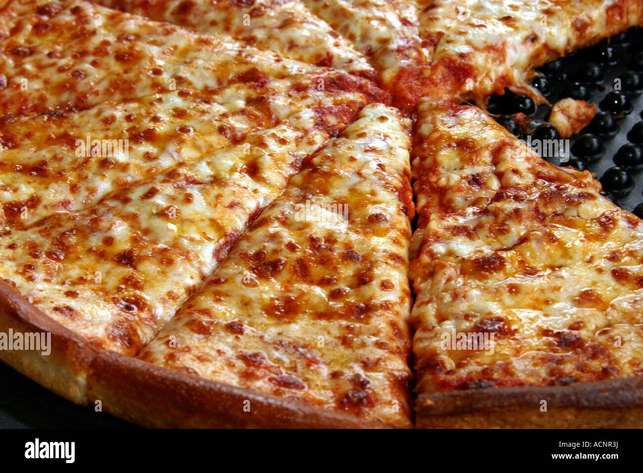 Closeup of a cheese pizza Stock Photo - Alamy