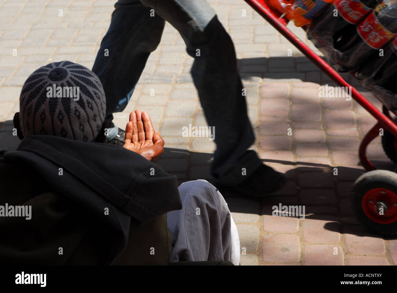 A man begging on the street in Marrakech, Morocco Stock Photo - Alamy