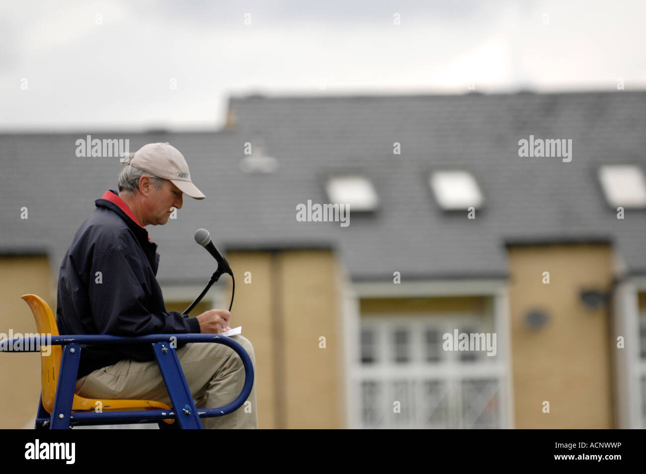 Tennis umpire on raised chair Stock Photo - Alamy
