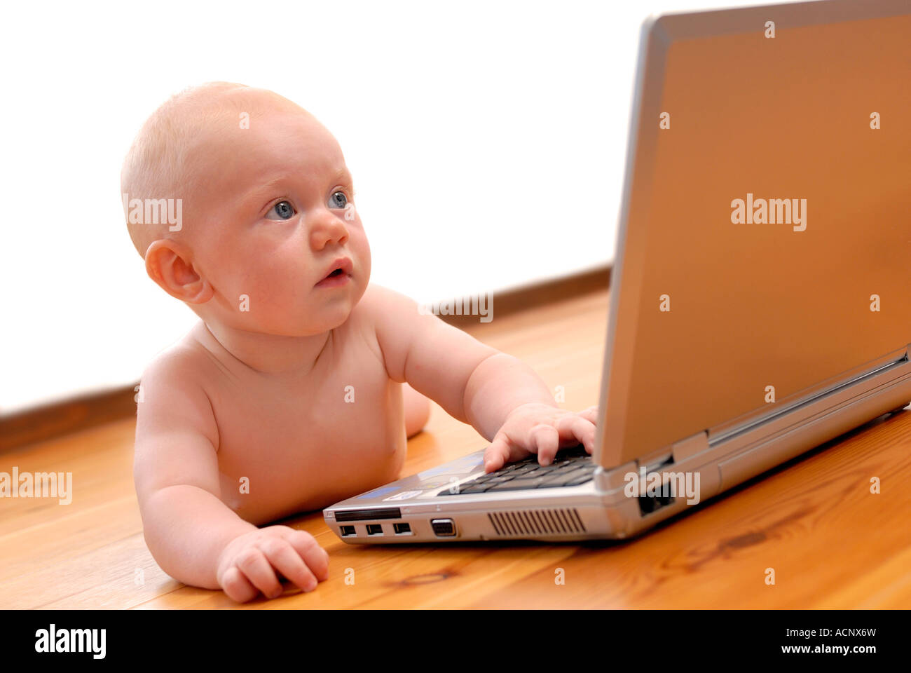 infant baby using laptop computer Stock Photo - Alamy