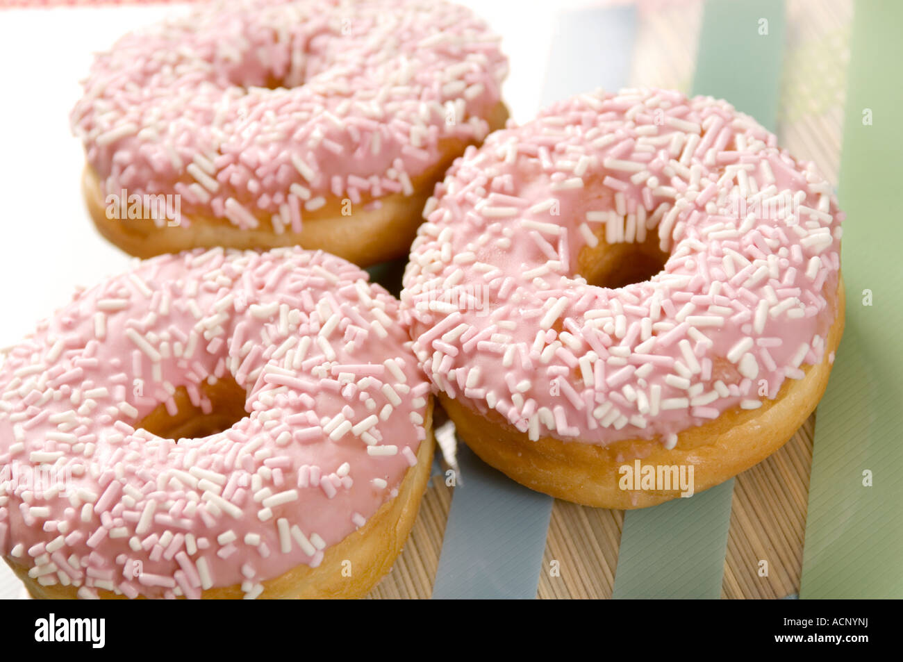 three doughnuts on the breakfast table Stock Photo - Alamy