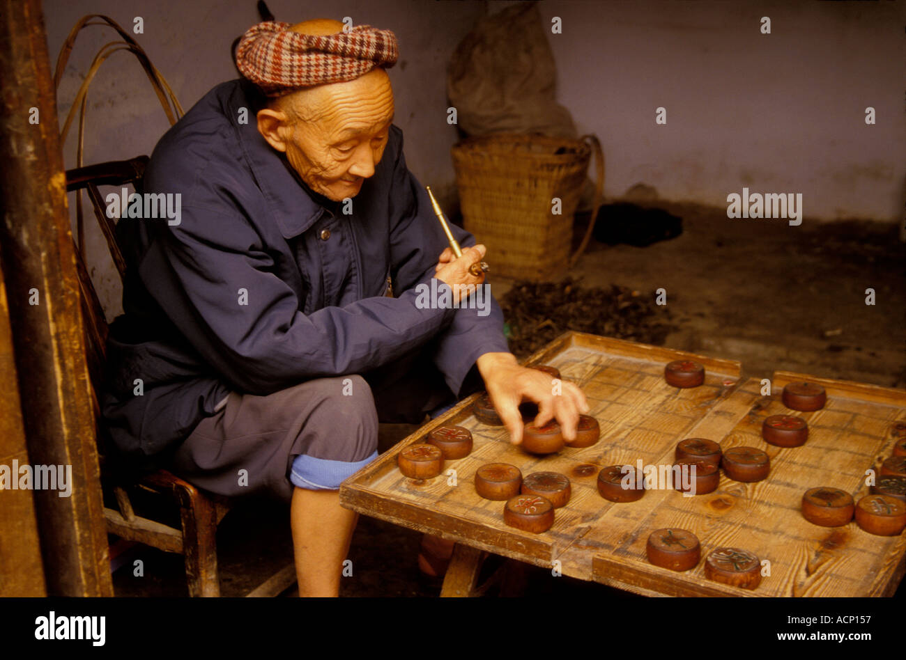 An old man playing Chinese chess Sichuan Province Three Gorges Yangtze ...
