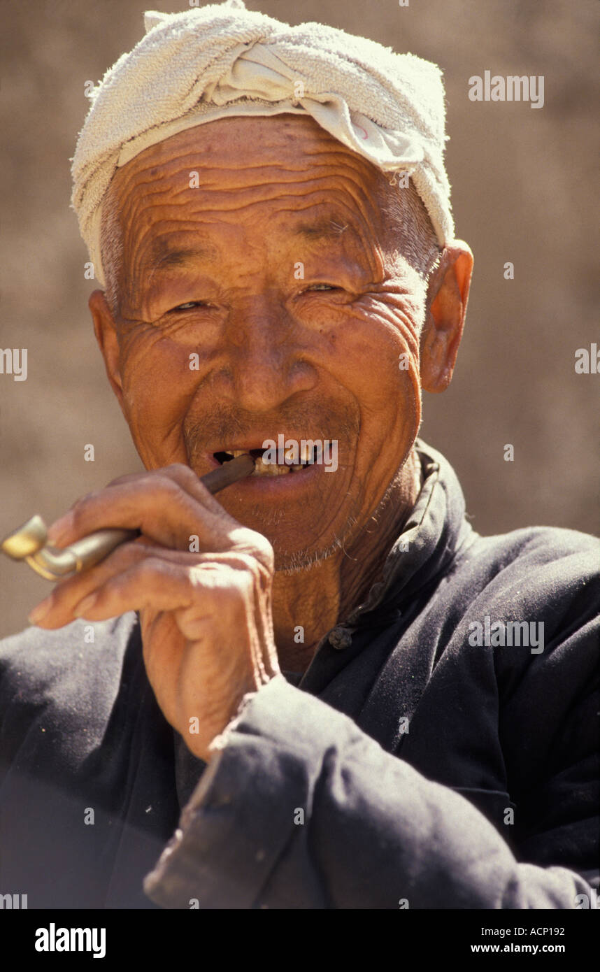 Portrait of a farmer smoking a pipe Loess Plateau Shaanxi Province ...