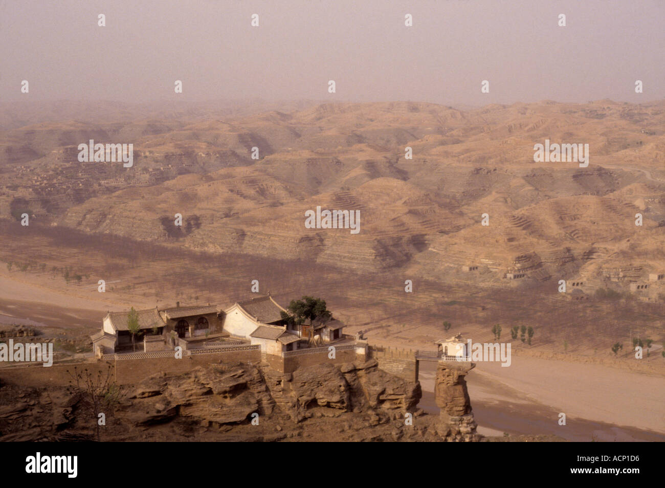 A village on the bank of Yellow River Huang He with Loess Plateau ...