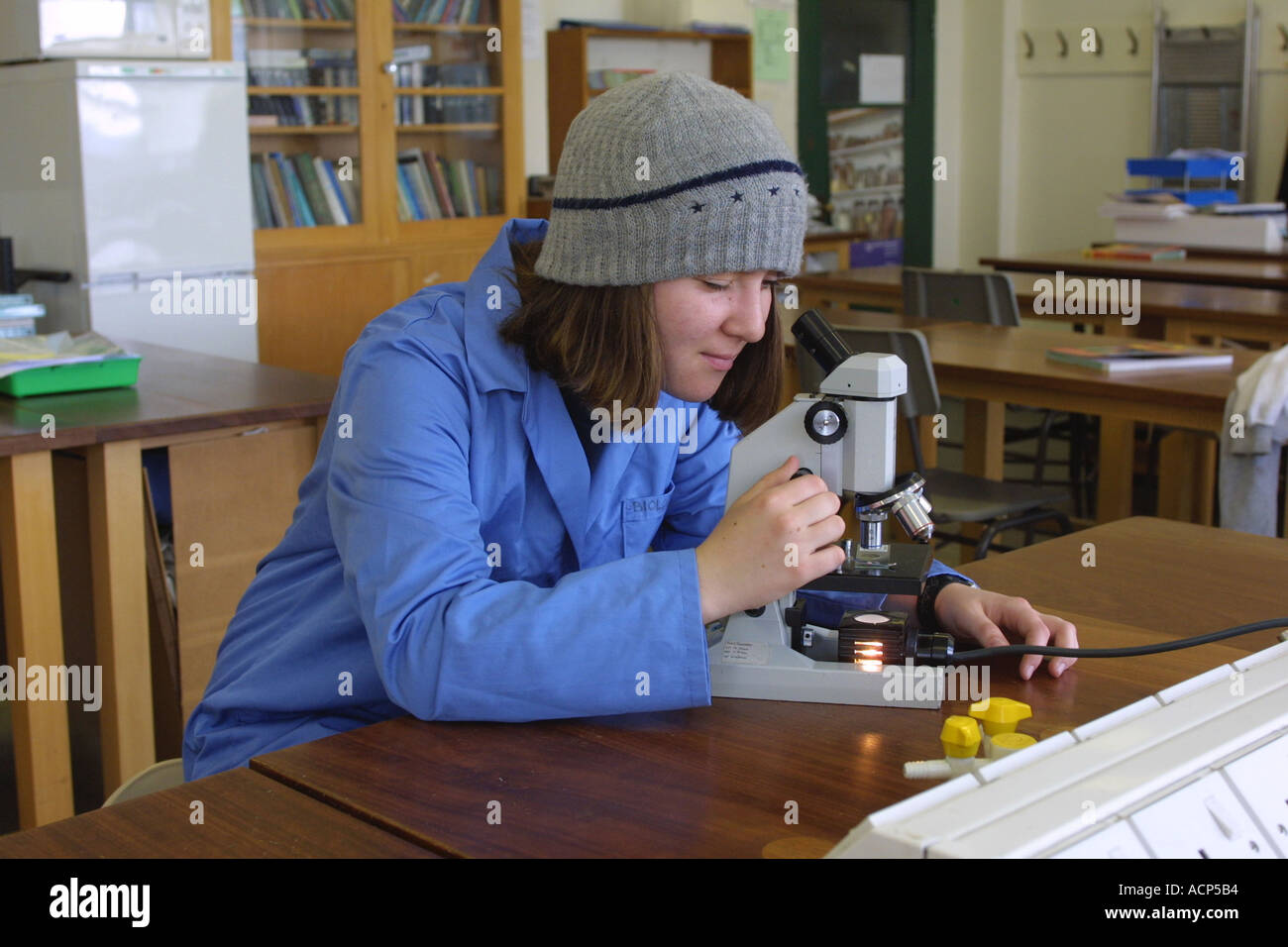 Student using microscope in science lab at Sixth form College South ...