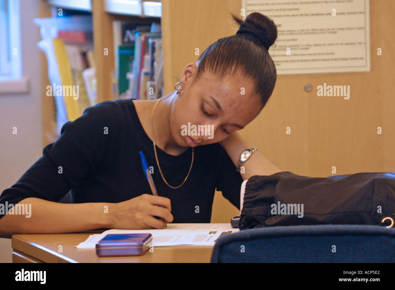 Female Student studying in library at Sixth form college South London ...