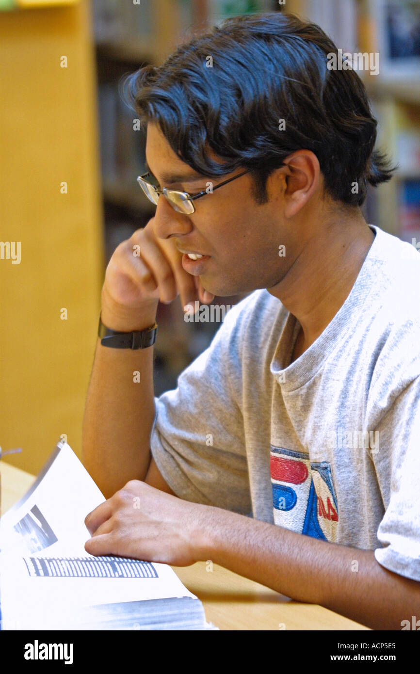 male Student studying in library at Sixth form college South London GB ...