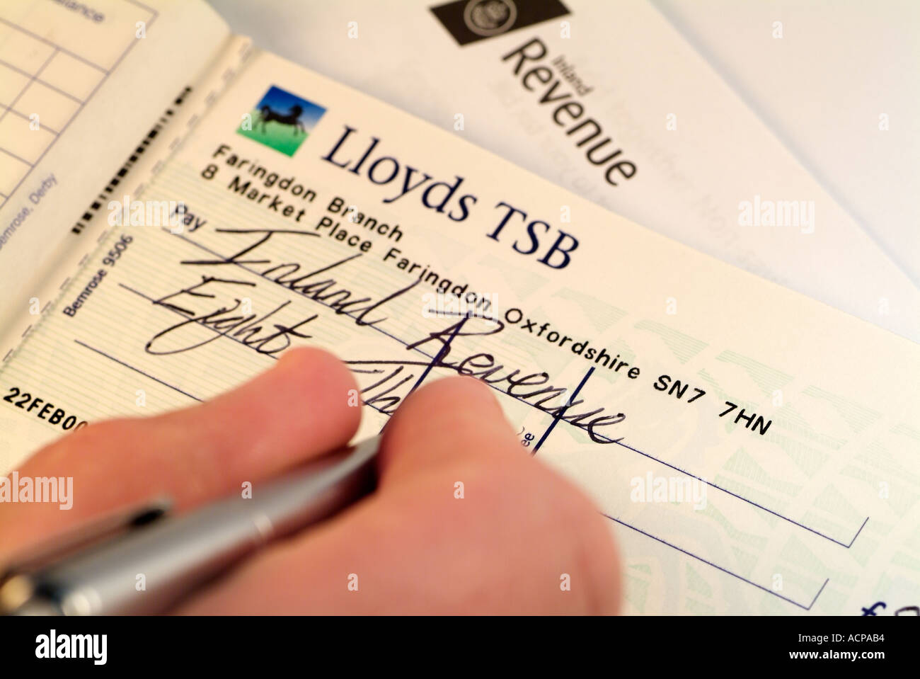 Writing a Cheque to the United Kingdom Inland Revenue to Pay a Tax Bill ...