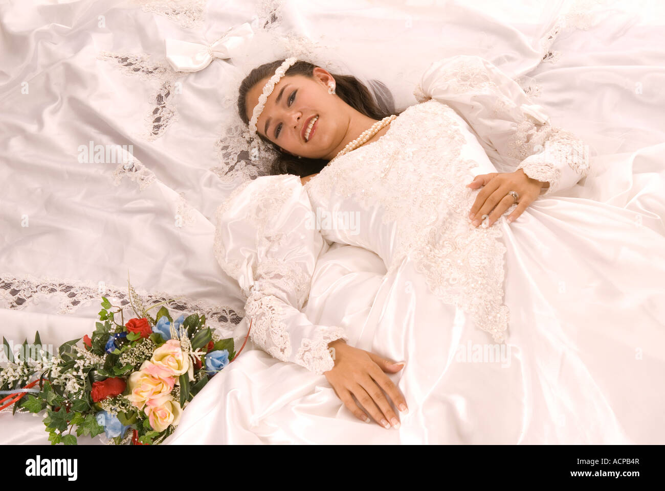 Bride lying down hi-res stock photography and images - Alamy