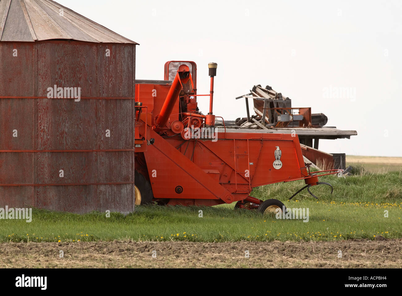 Old Case Combine beside grain bin in scenic Saskatchewan Canada Stock ...