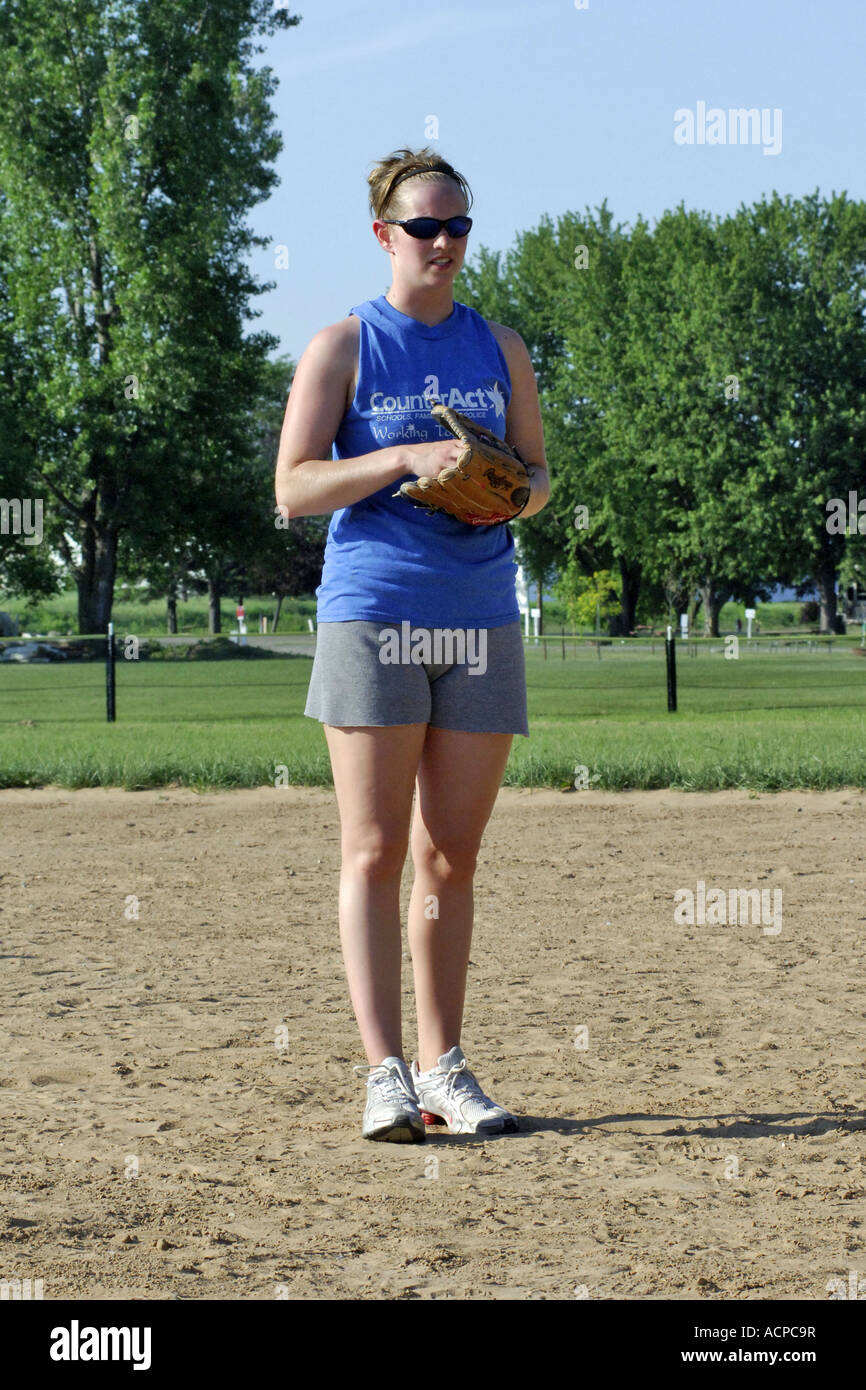 2nd grade school childrens softball practice with a Mother pitching the ...