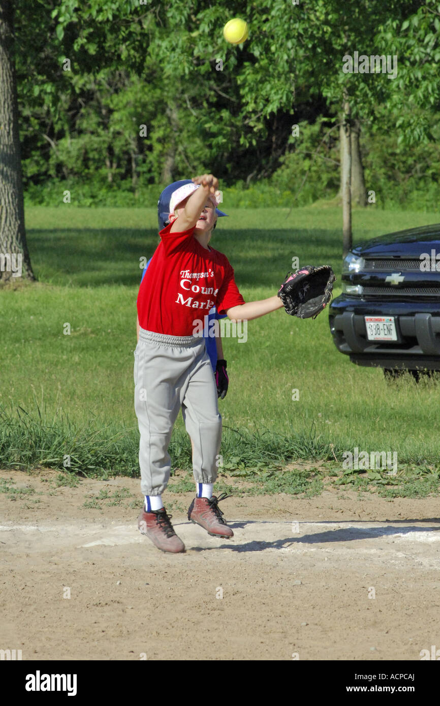2nd grade school childrens softball practice Stock Photo - Alamy