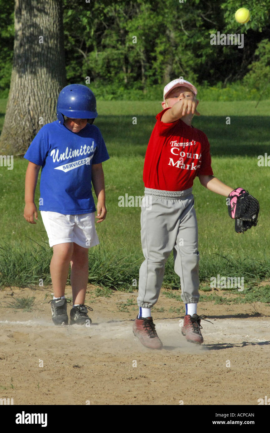 2nd grade school childrens softball practice Stock Photo - Alamy