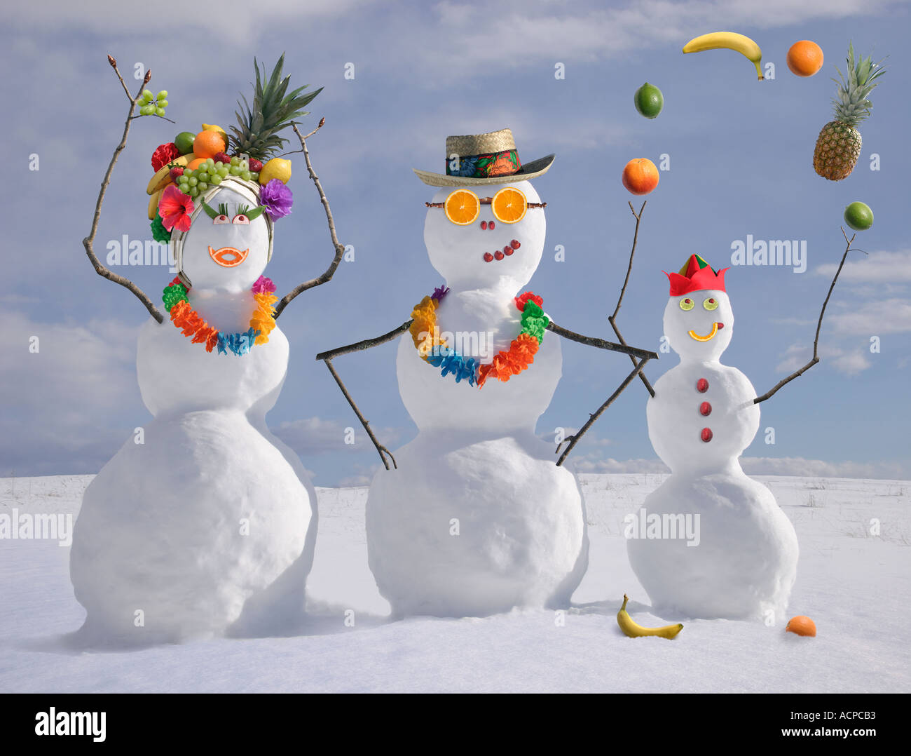 Snowman Family with Fruit Stock Photo - Alamy