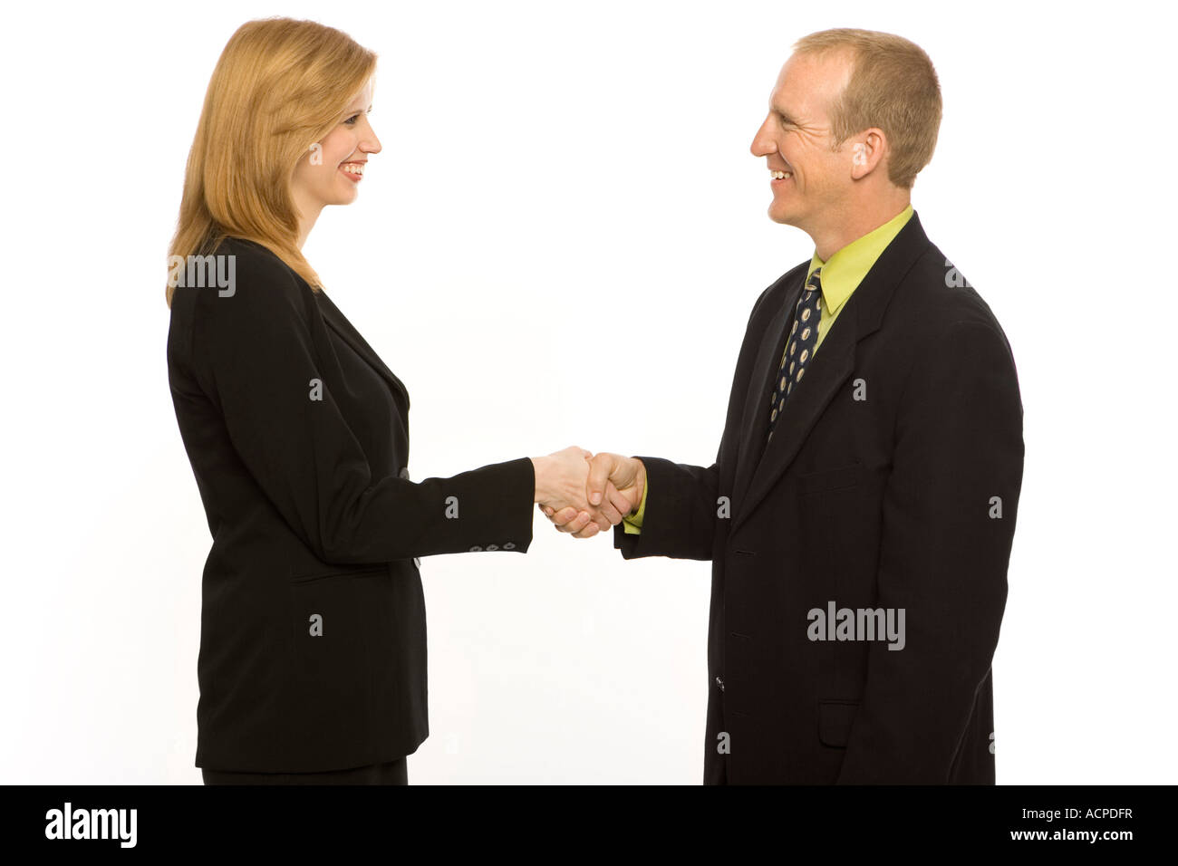 Two business people shake hands Stock Photo - Alamy