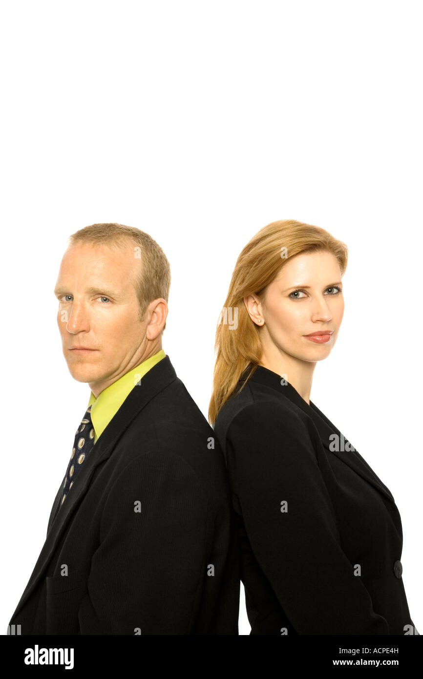 Two business people stand back to back Stock Photo - Alamy