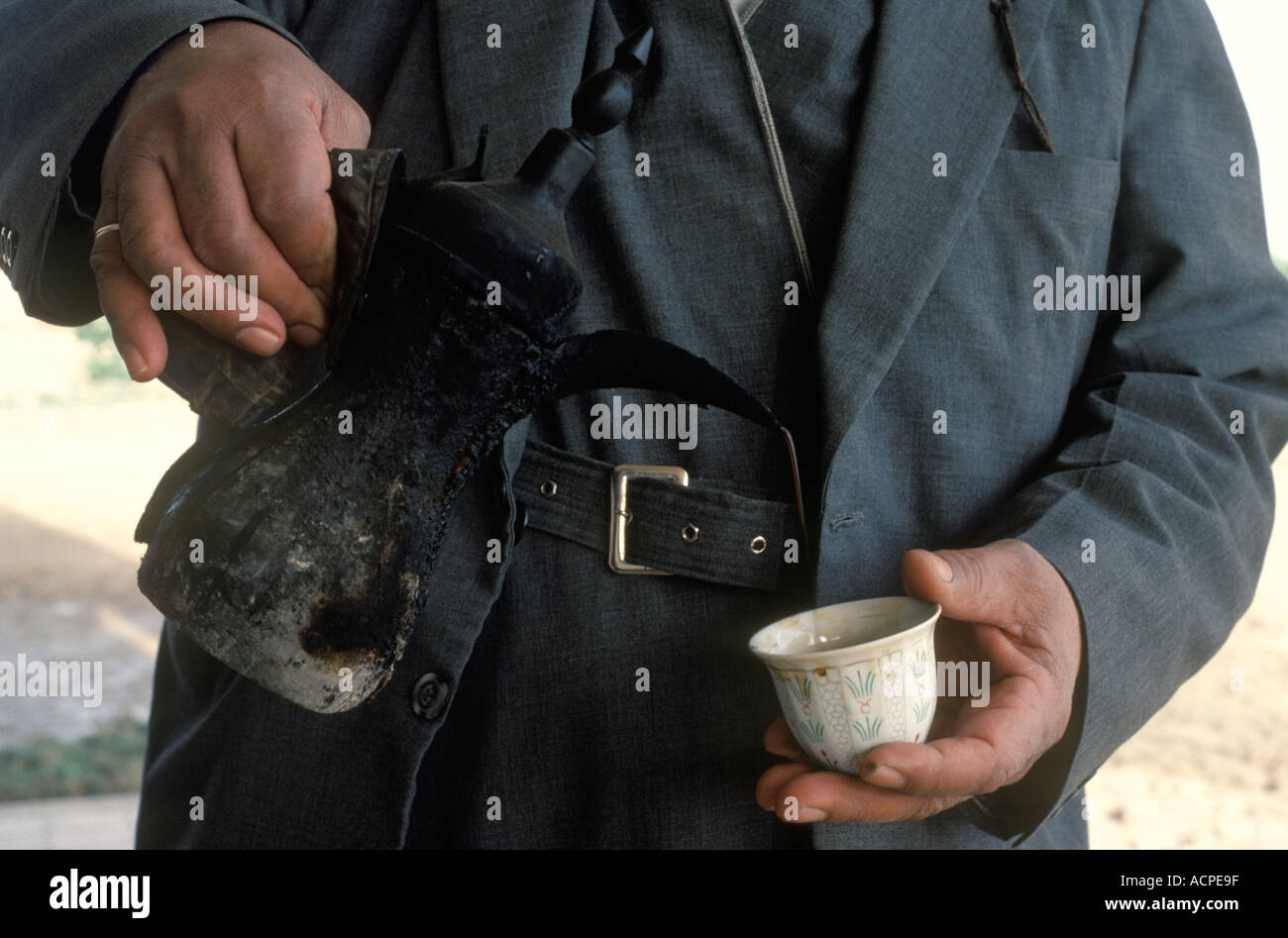 Marsh Arab Iraq, man pouring a cup of coffee Mesopotamian Marshes ...