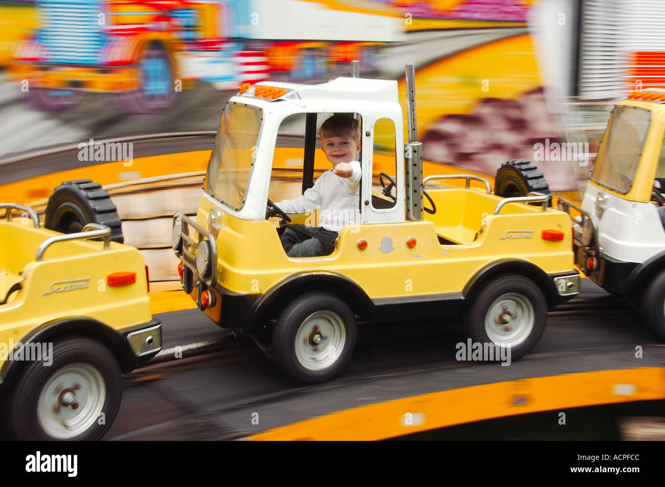 Small boy riding a carnival ride lorry Stock Photo - Alamy