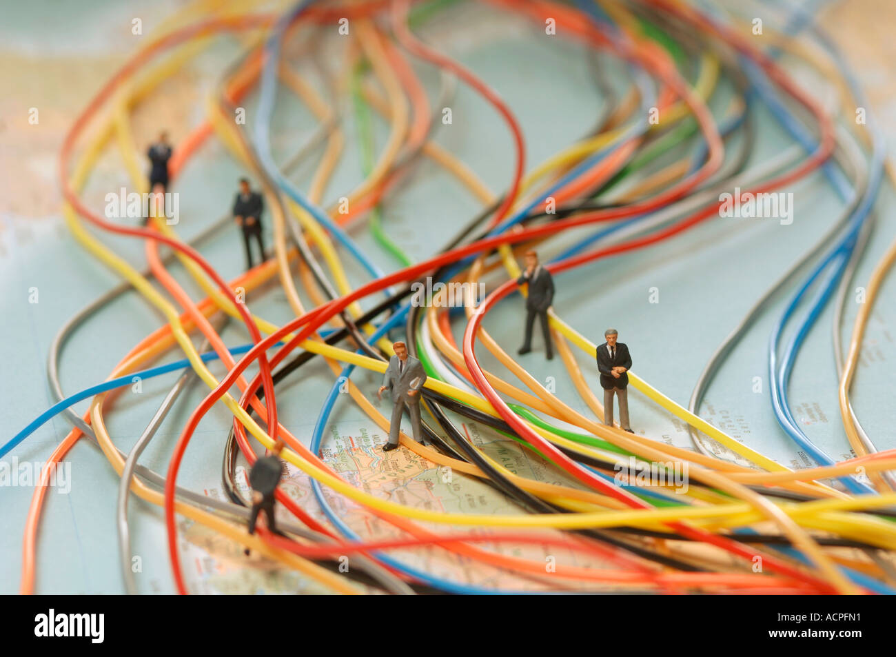 Businessmen standing between plastic wires Stock Photo - Alamy