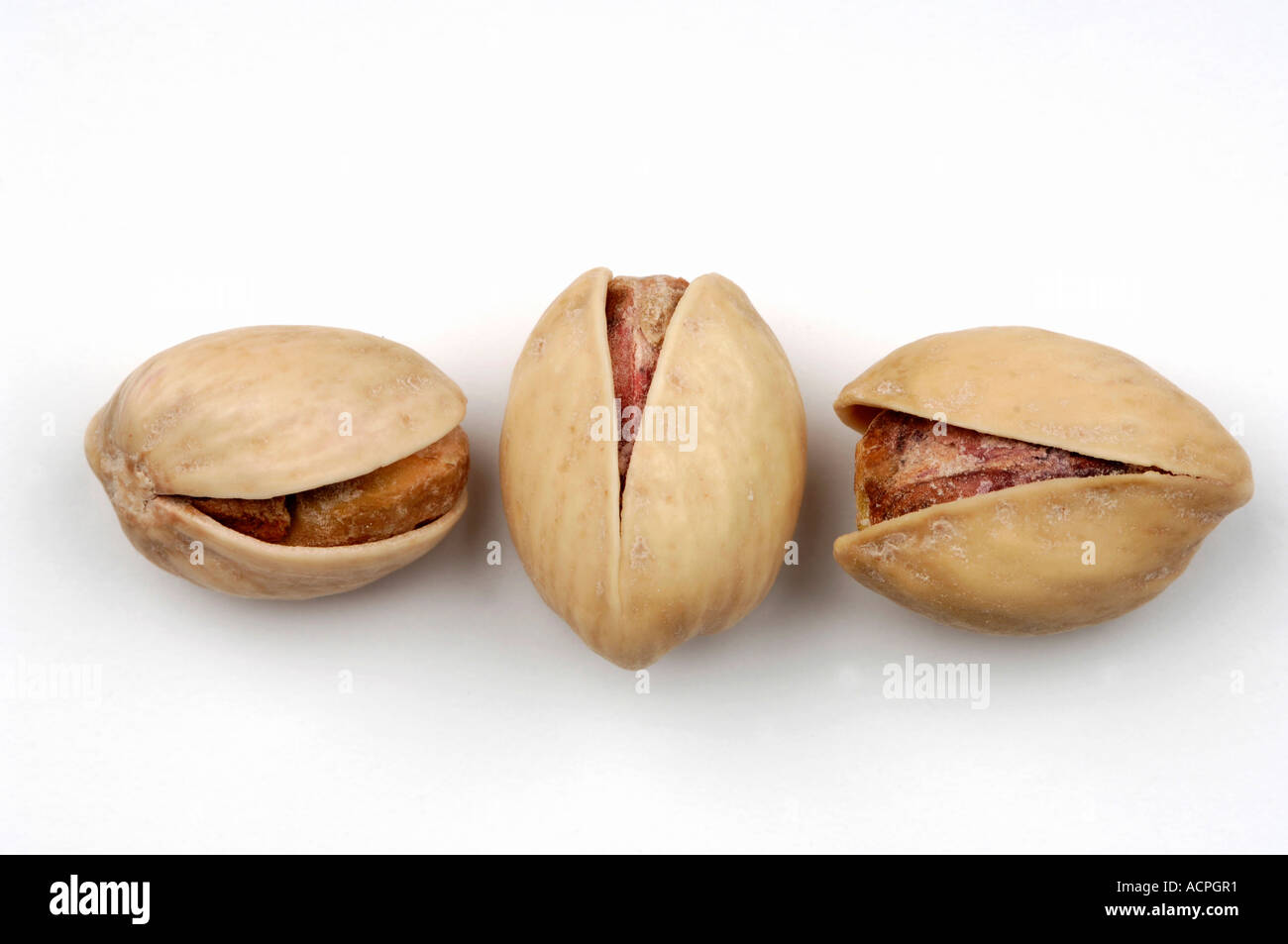 Three pistachio nuts Stock Photo - Alamy