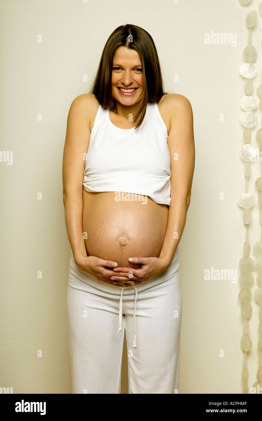 Hand on bellies hi-res stock photography and images - Alamy