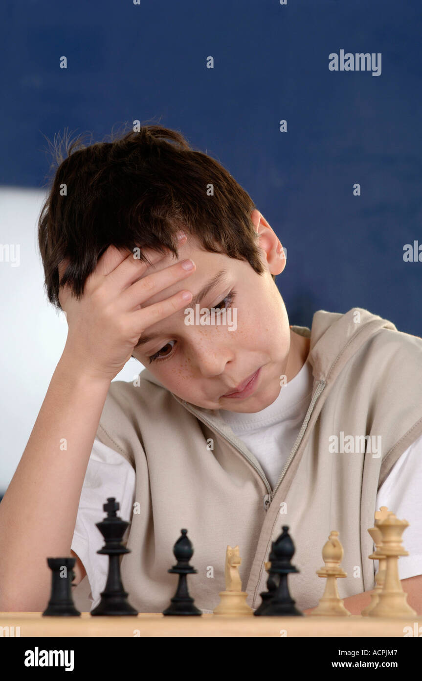 Boy playing chess Stock Photo - Alamy