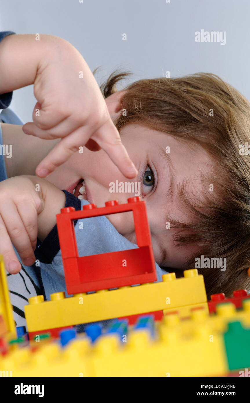 Boy playing with LEGO bricks Stock Photo - Alamy