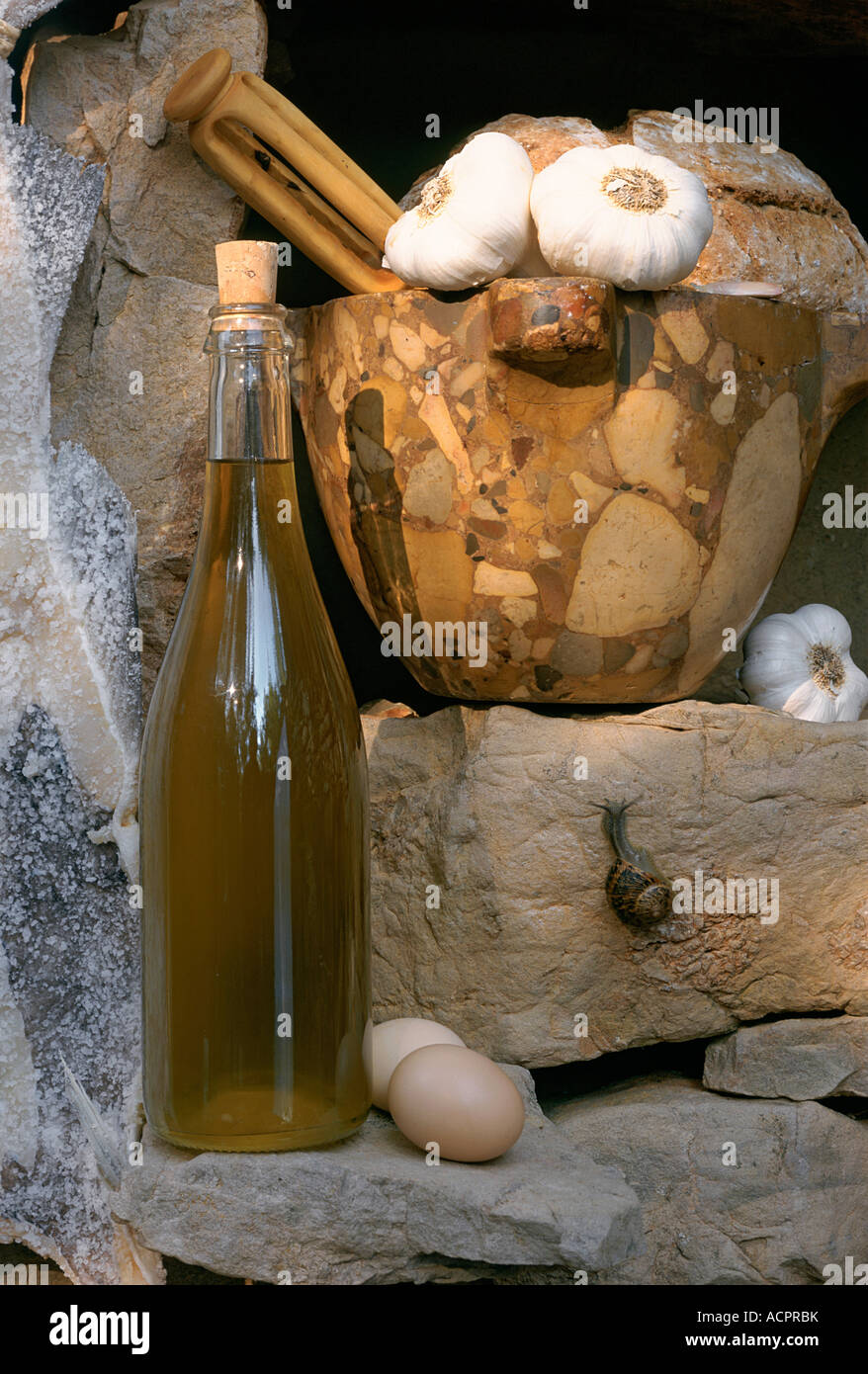 Bottle of white wine eggs in front of a salad bowl garlic Stock Photo ...