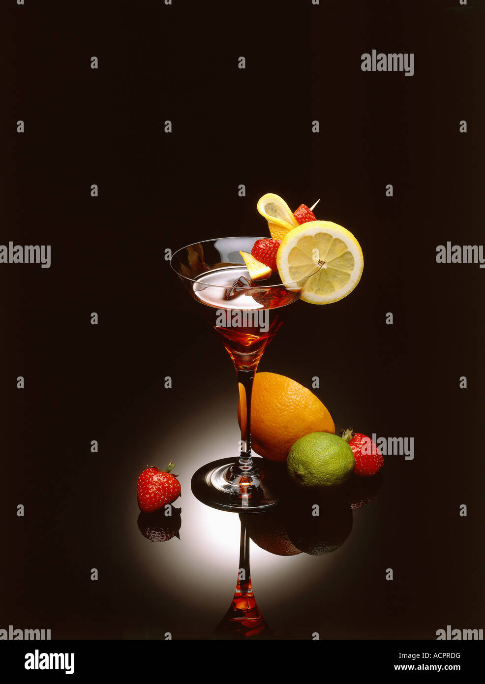 Cocktail and fruits black background Stock Photo - Alamy