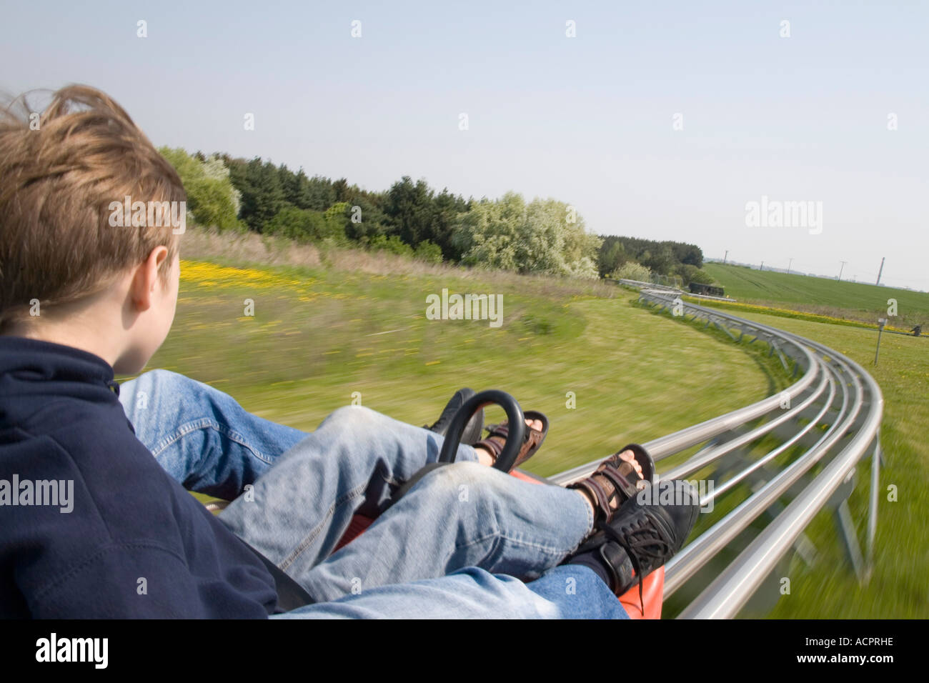 Boys (10-11) in toboggan run, elevated view Stock Photo - Alamy