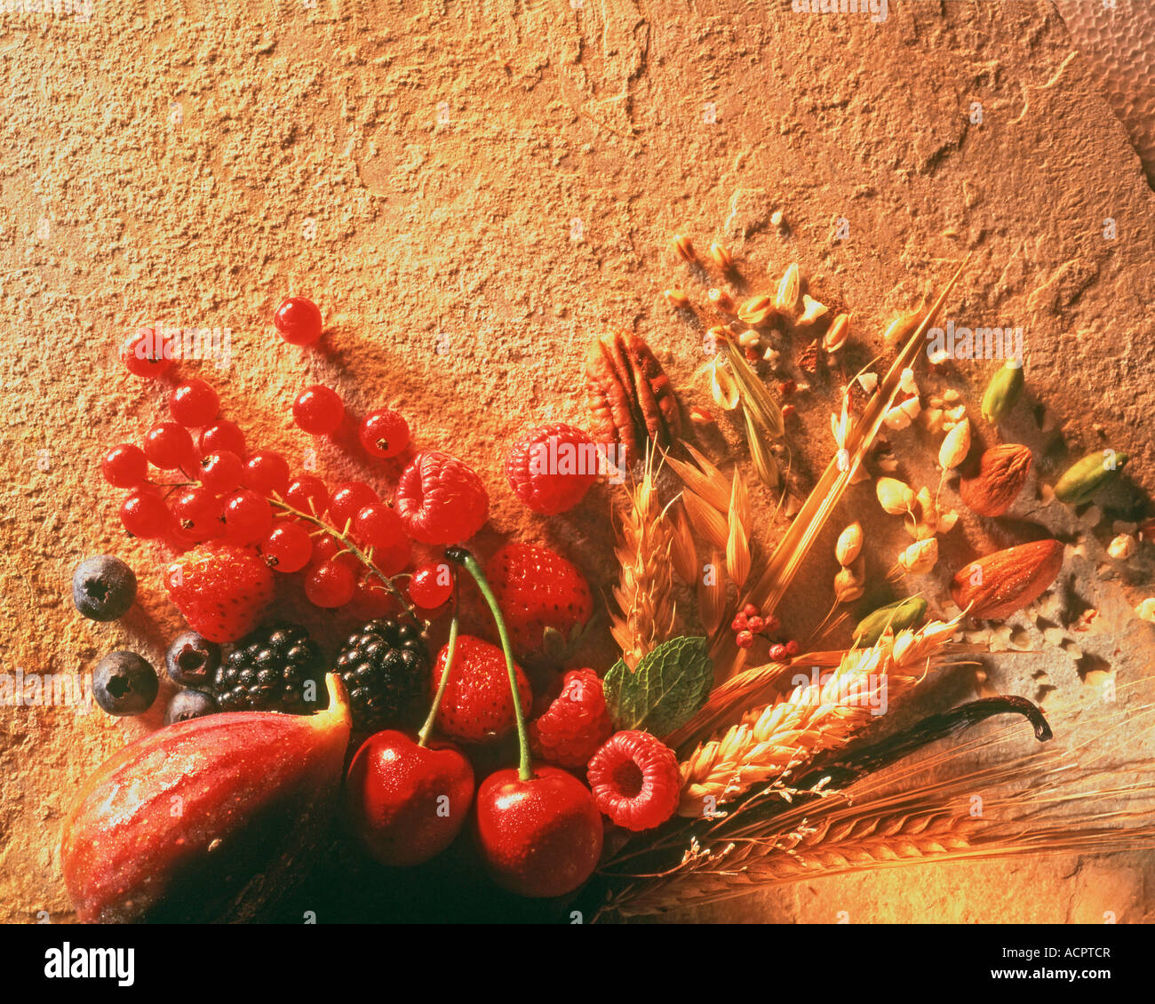 Composition red fruits and dry fruits Stock Photo - Alamy