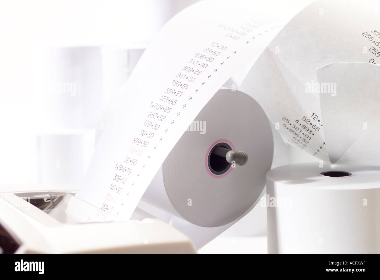 Desk calculator and printed paper roll Stock Photo - Alamy
