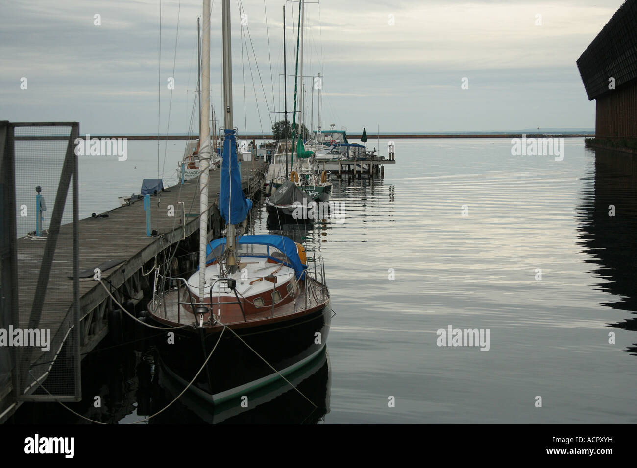 Boats tied up along the dock Stock Photo - Alamy