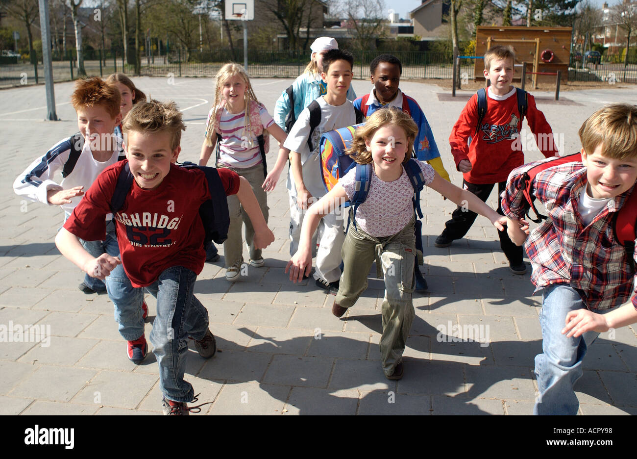 Group of children going into school Stock Photo - Alamy