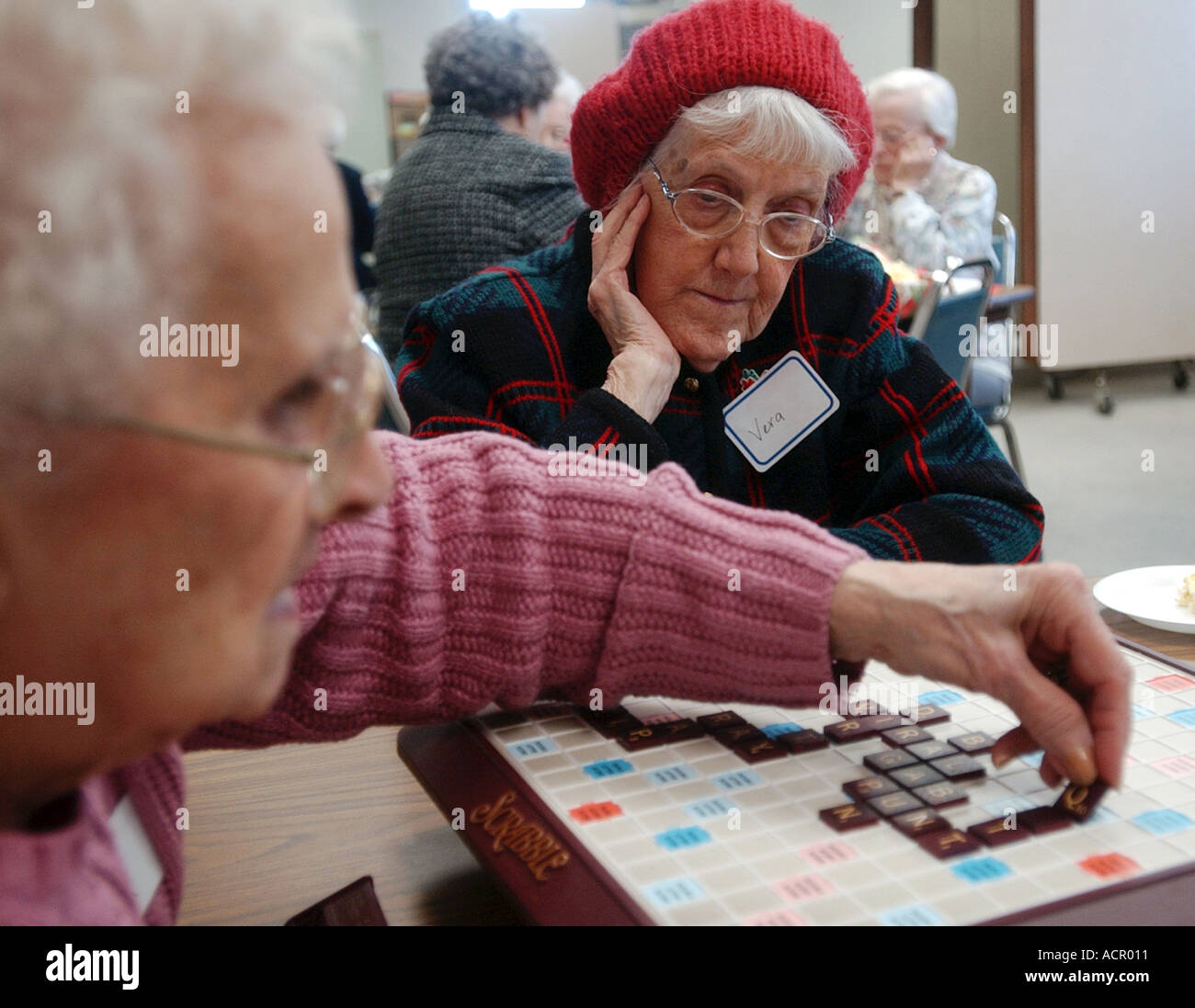seniors citizens playing scrabble board game during a tournament Stock ...