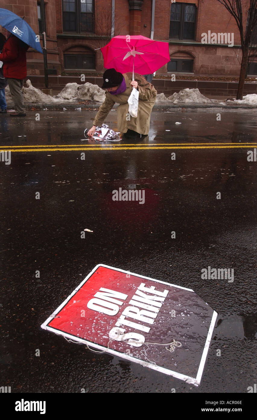Strikers cleaning up after union strike Stock Photo - Alamy