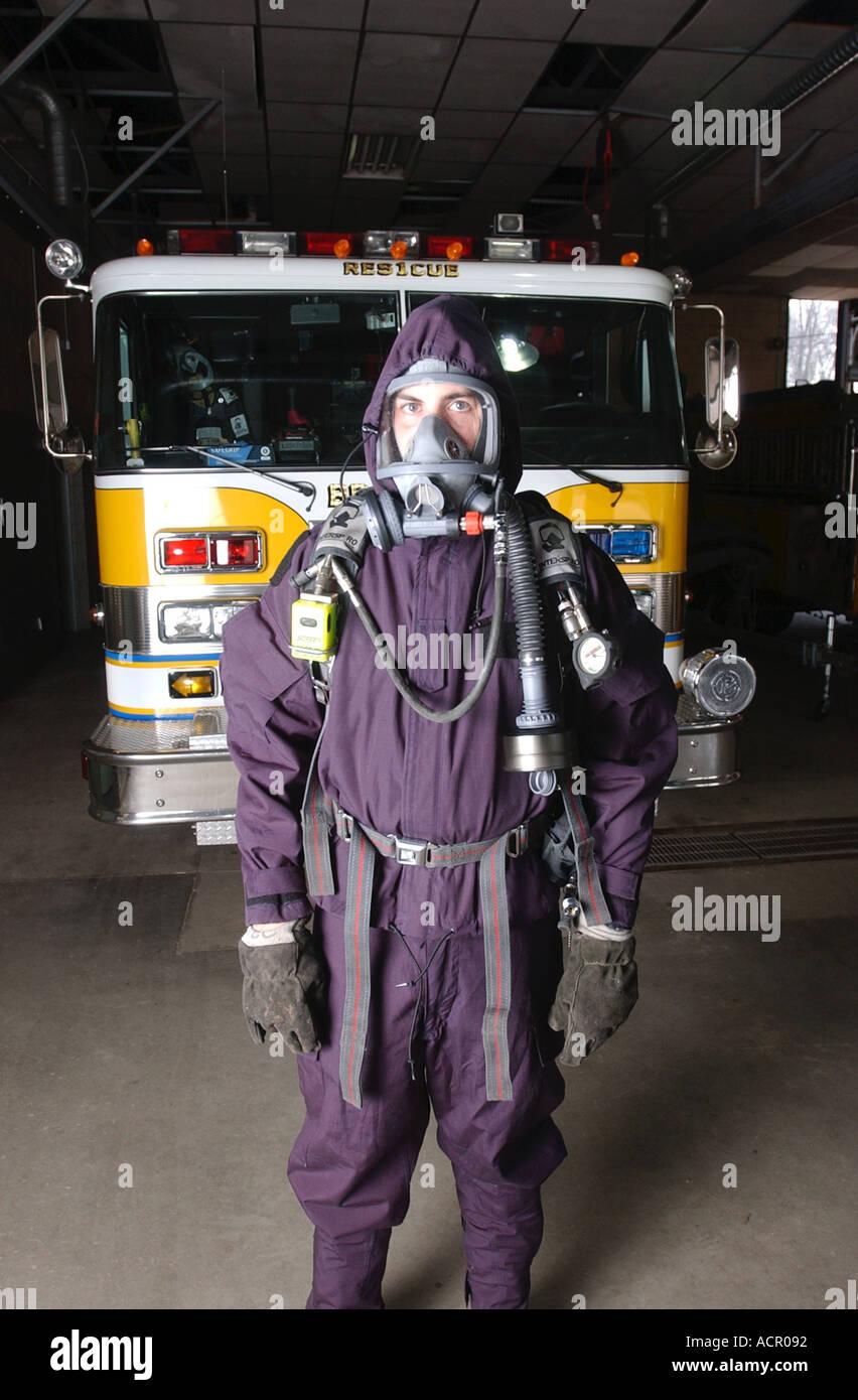 Firefighter with biohazard emergency gear mask and suit Stock Photo - Alamy