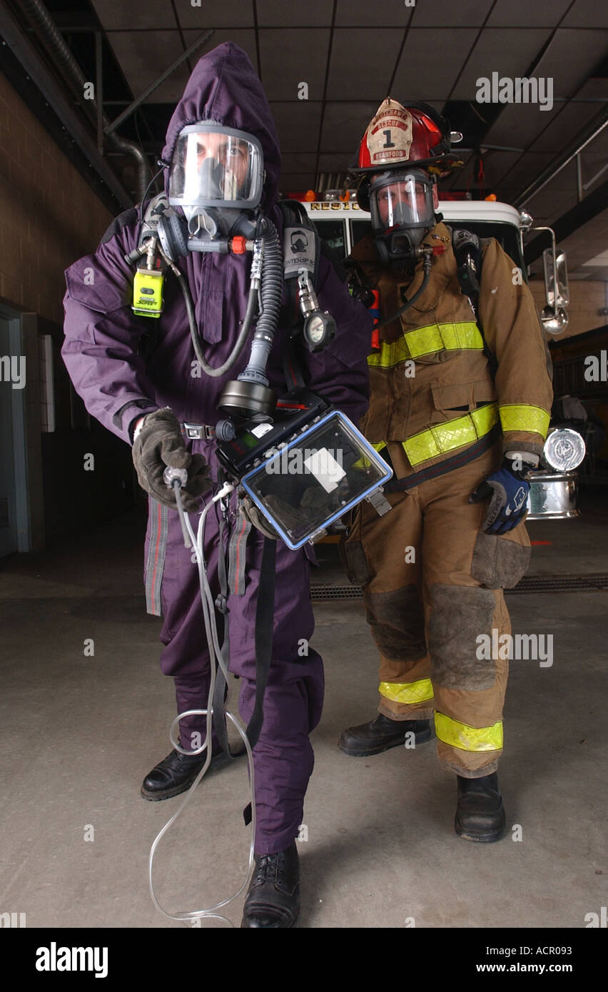 Firefighter with biohazard emergency gear mask and suit Stock Photo - Alamy