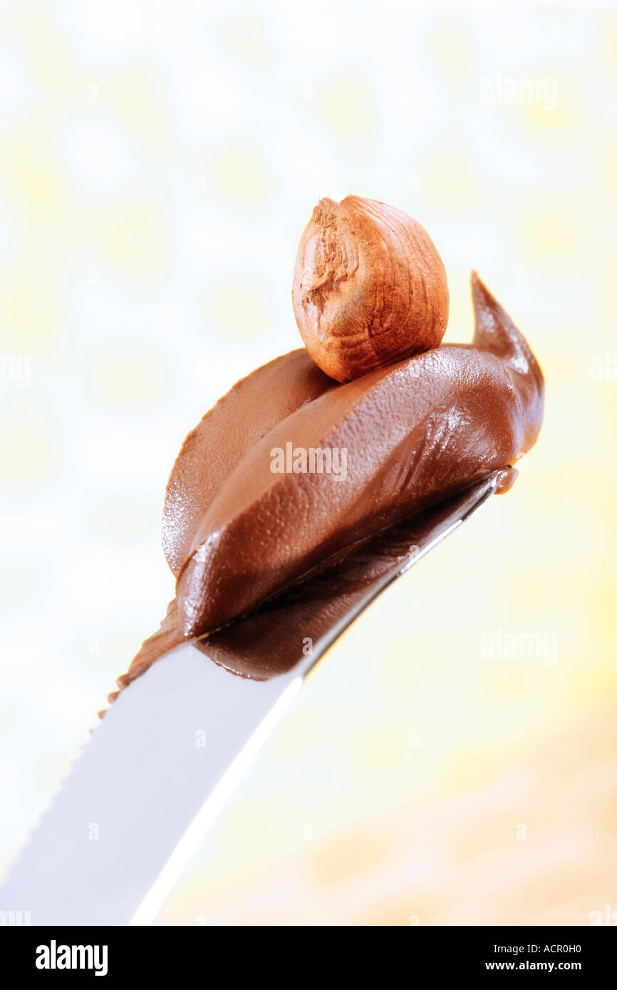 Chocolate spread on knife Stock Photo - Alamy