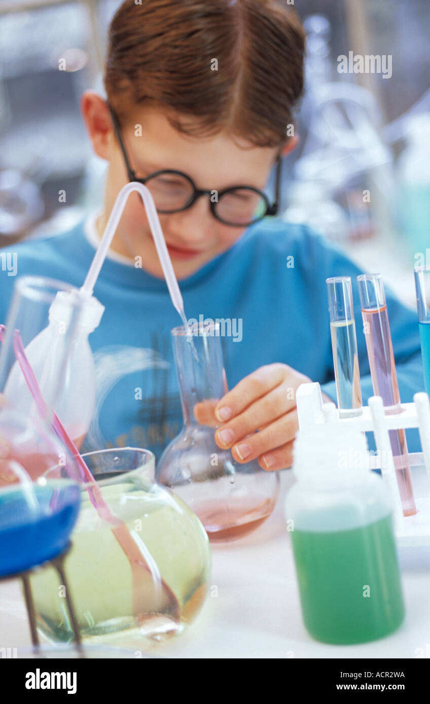 Boy (10-11) in chemical lab Stock Photo - Alamy