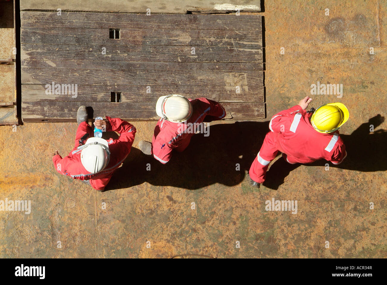 Three construction workers Stock Photo - Alamy