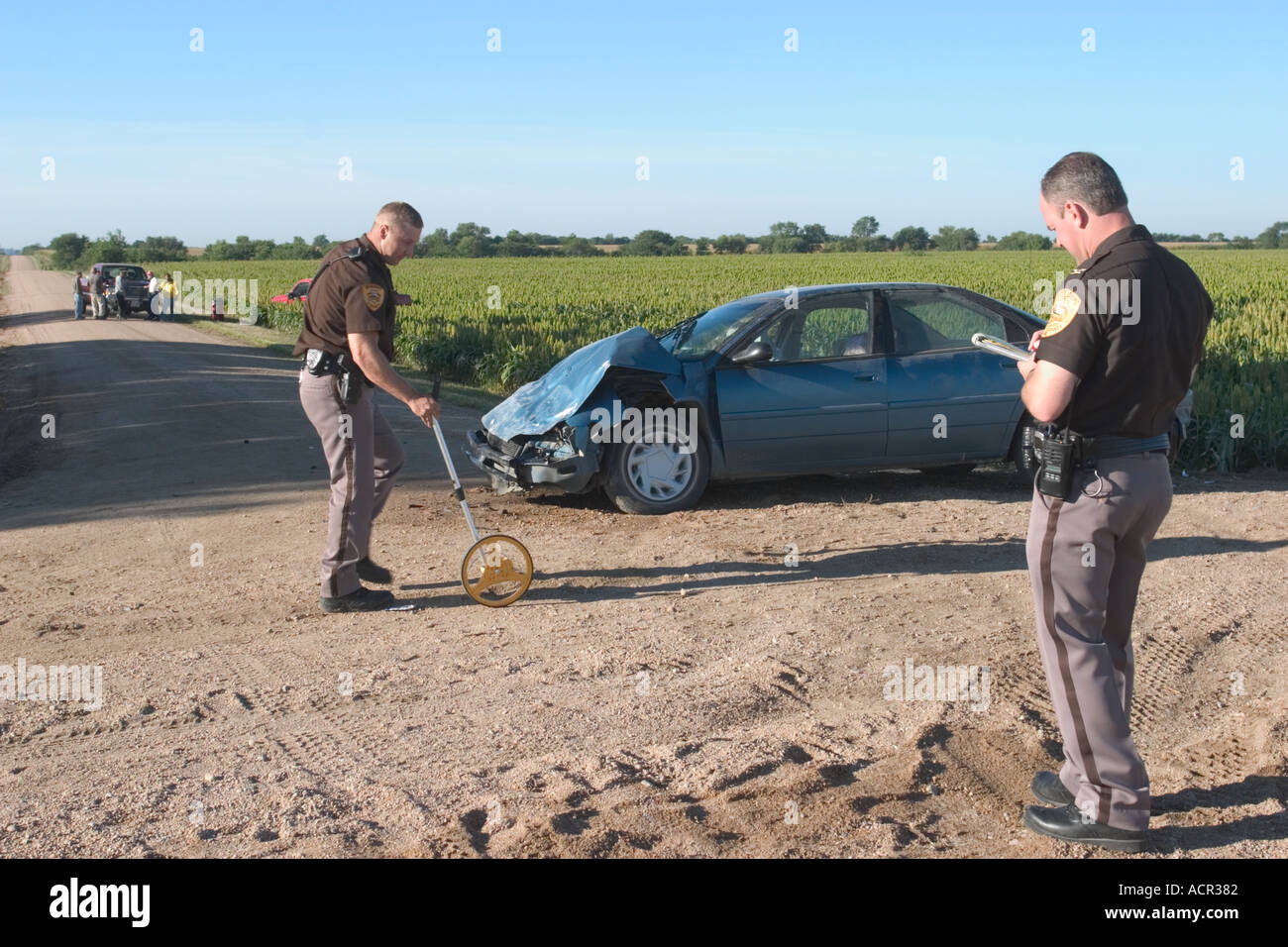 Sheriff deputy measuring skid marks hi-res stock photography and images ...