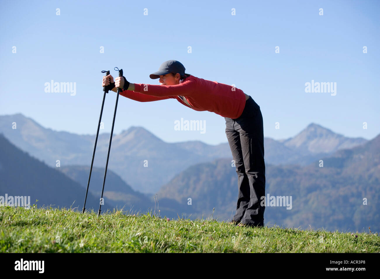 Young woman stretching nordic walking hi-res stock photography and ...