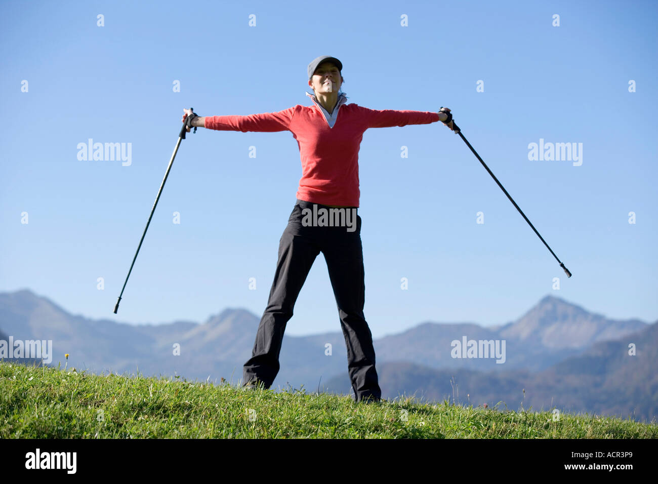 Young woman stretching nordic walking hi-res stock photography and ...