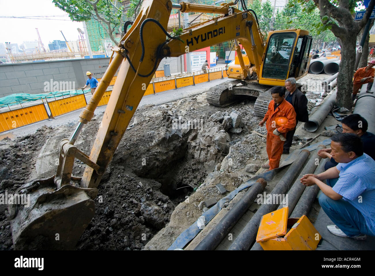 Chinese Workmen using Hyundai Heavy Equipment for Roadwork in Shanghai ...