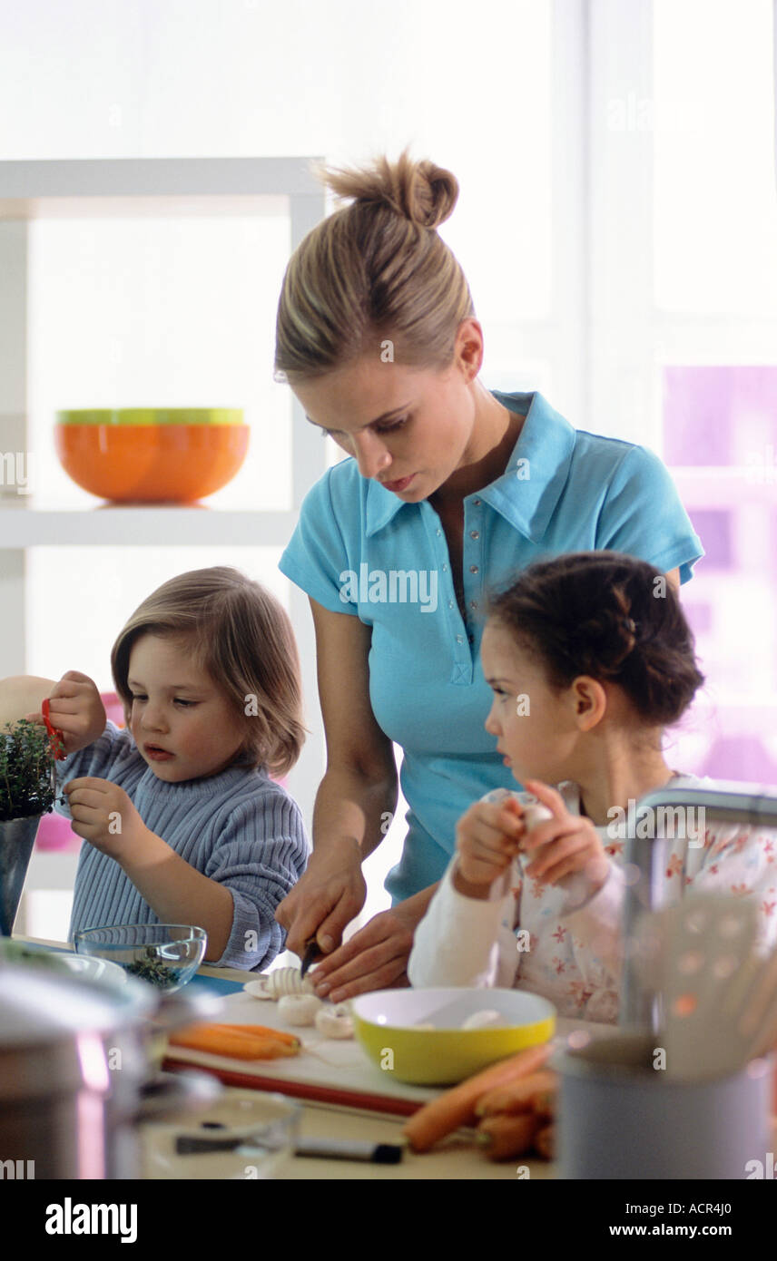 Meal kitchen 3 adults children hi-res stock photography and images - Alamy