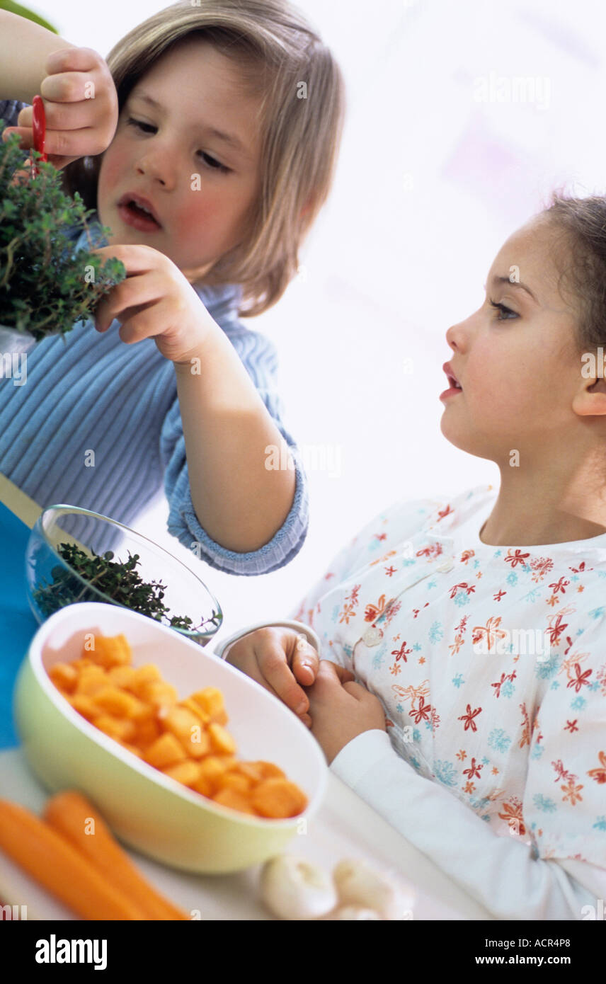 Children (4-7) preparing meal Stock Photo - Alamy