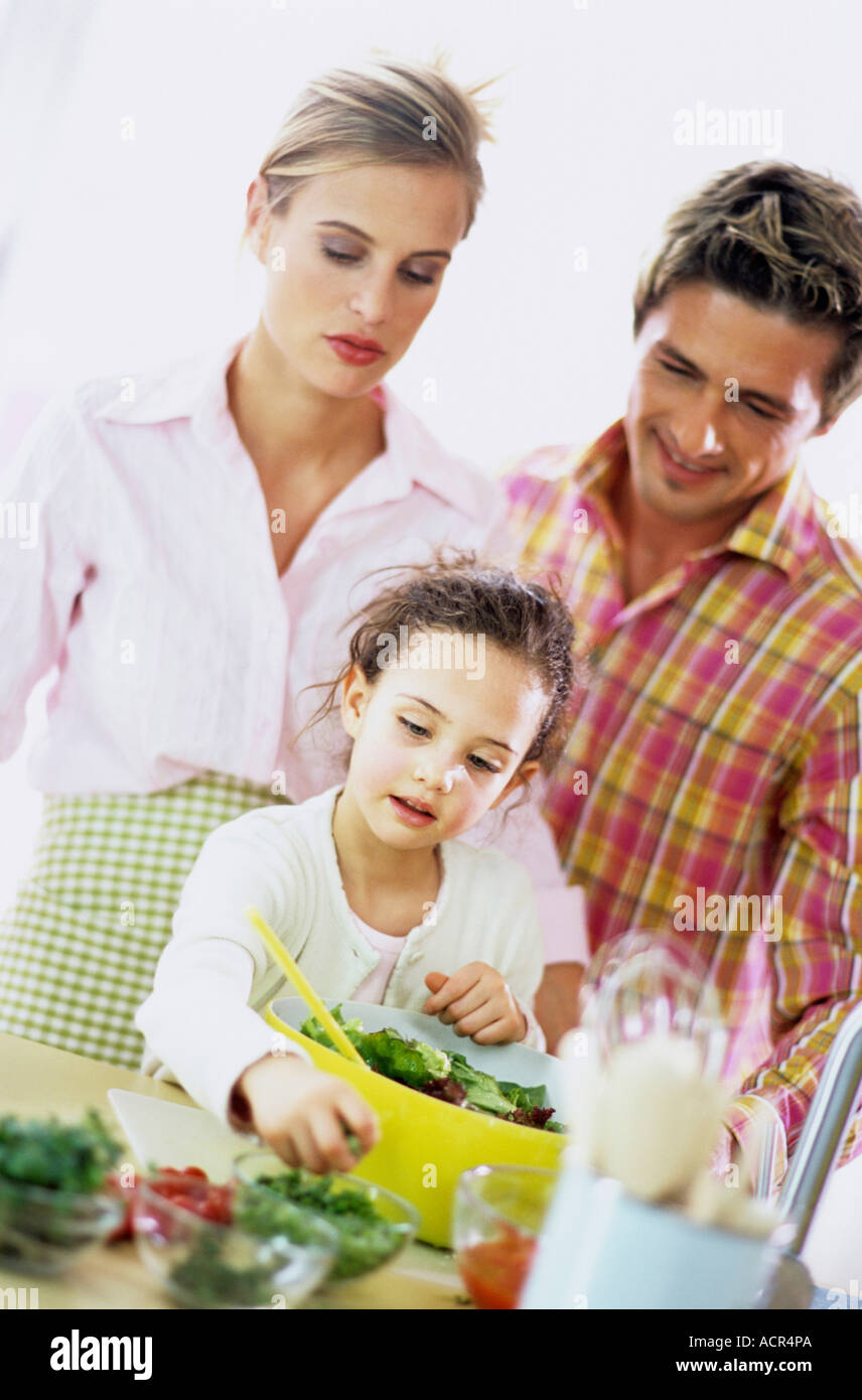 Daughter watching mother cook hi-res stock photography and images - Alamy