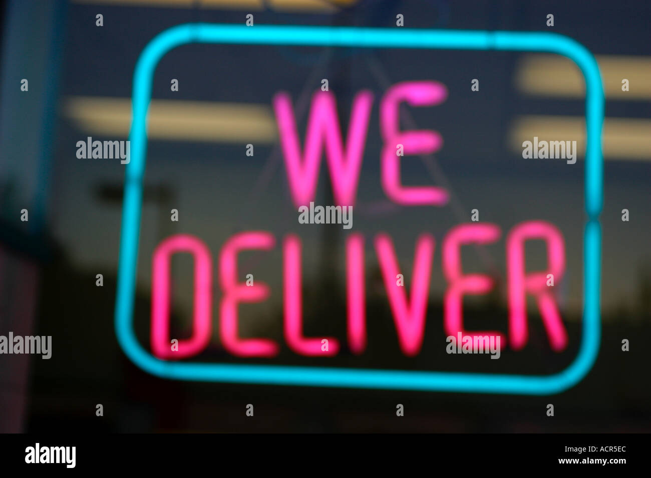 We Deliver Neon Sign Stock Photo - Alamy