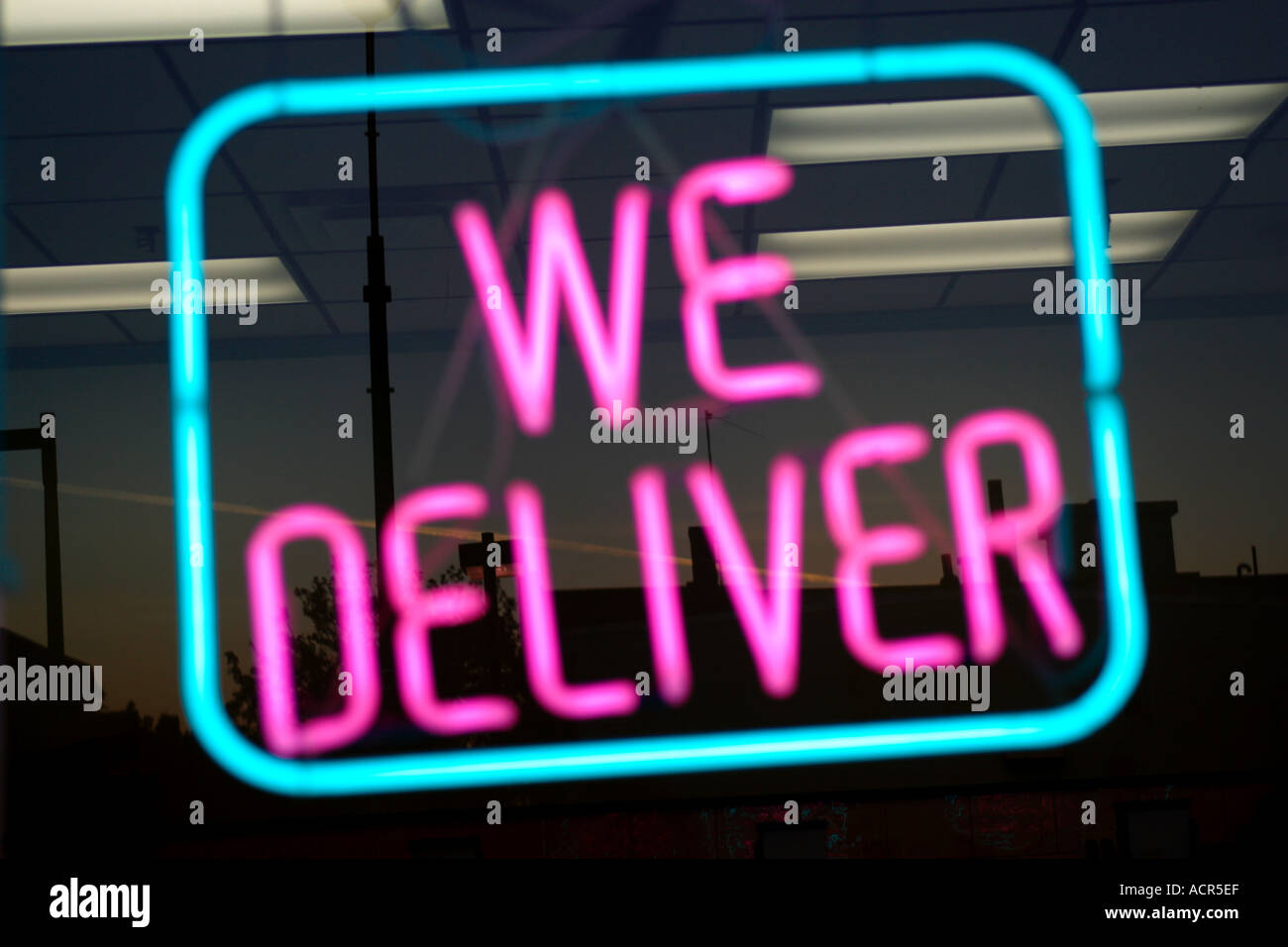 We Deliver Neon Sign Stock Photo - Alamy